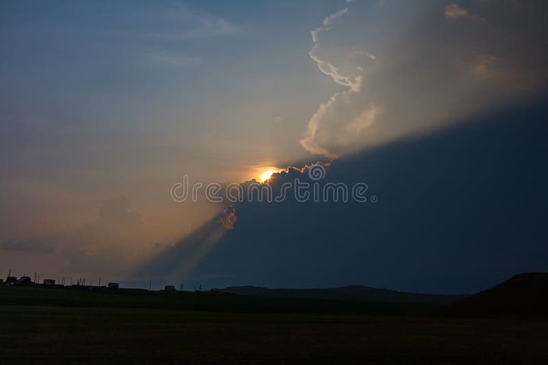 Evening Sun Going through Dark Stormy Clouds with Rays in Steppe Stock ...
