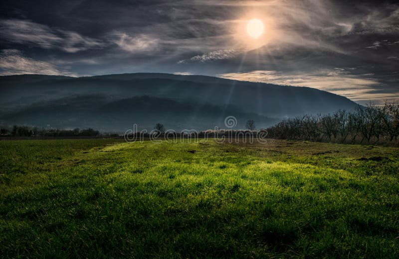 Evening Sun Rays on a Landscape Stock Image - Image of sunbeam, hills ...