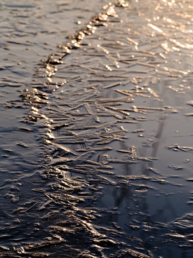 Evening Sun Reflection in Dark Ice on Pond Stock Photo - Image of ...