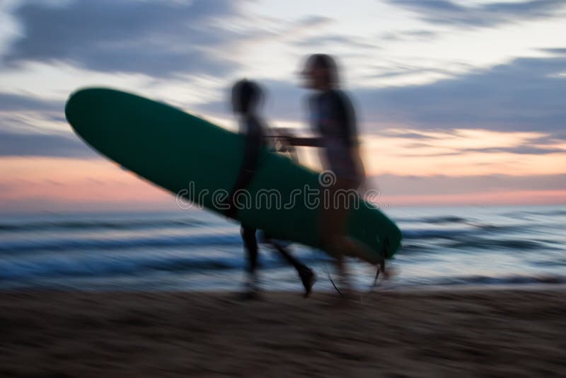 Surfing at Sunset stock photo. Image of extreme, hawaiian - 57507992