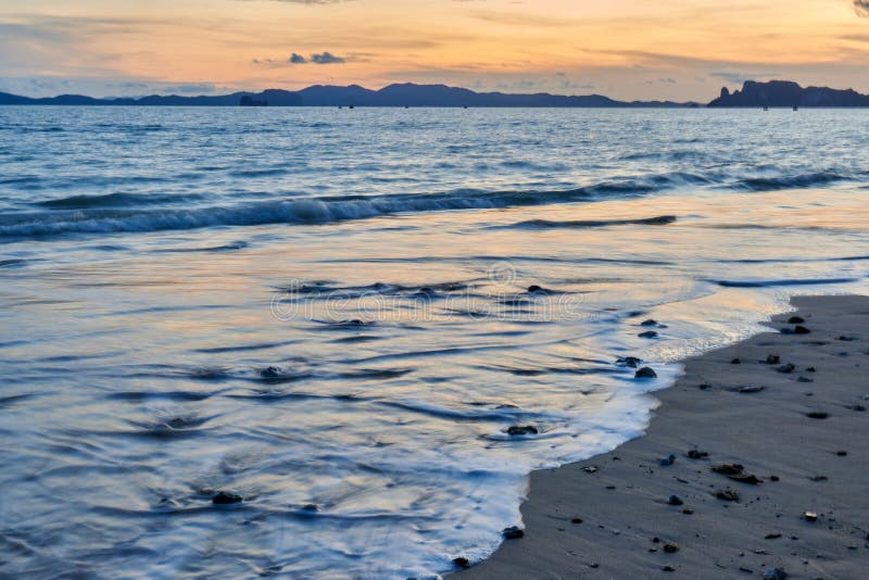 Evening View of a Calm Sea with Rocks on a Beach Stock Photo - Image of ...