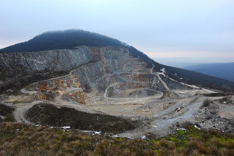 Evening View of Open-cast Quarry Mine with Stages of Mining and Tracks ...