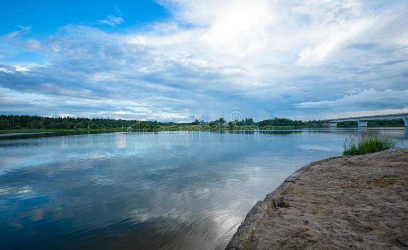 View of the River from the Shore with a Beautiful Sky and Clouds Stock ...