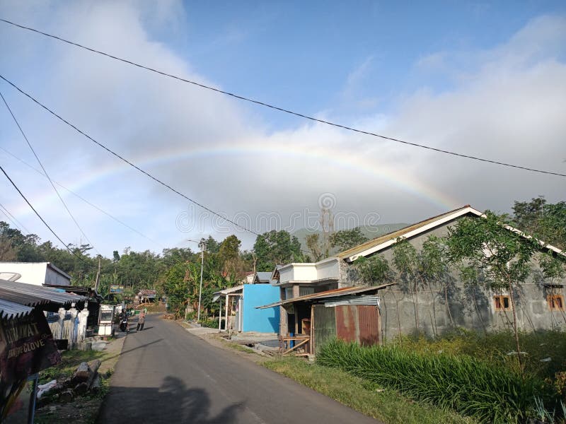 The Evening View in a Village Decorated with Beautiful Rainbow Scenery ...