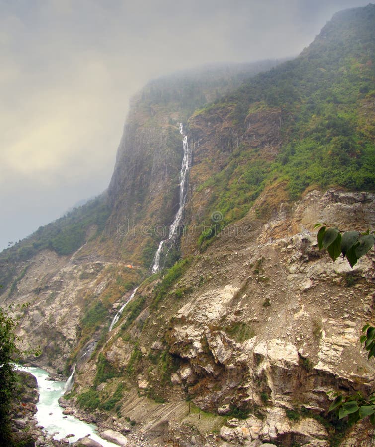Evening Waterfall in the Himalayas. Water from the Rock Falls in Stock ...
