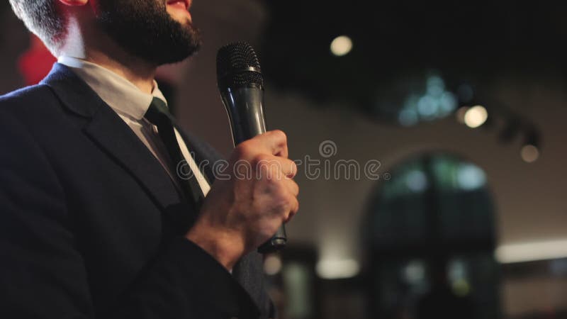 Event Host Gesturing Hands while Giving Speech in Microphone Stock ...