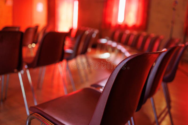 Event Location with Seats in a Room for an Event with Red Ambiance ...