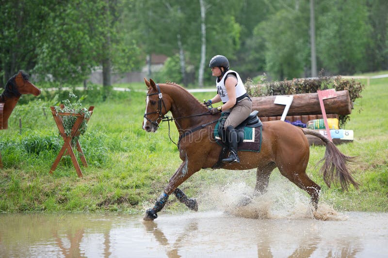 Eventer on Horse is Overcomes the Water Jump Editorial Stock Photo ...