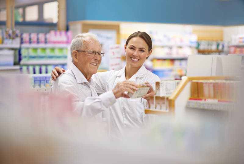Every Client is an Individual. a Young Pharmacist Helping an Elderly ...