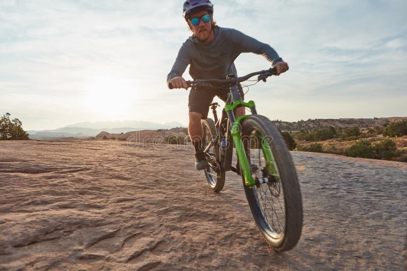 Every Ride is Different. a Young Man Out Mountain Biking during the Day ...