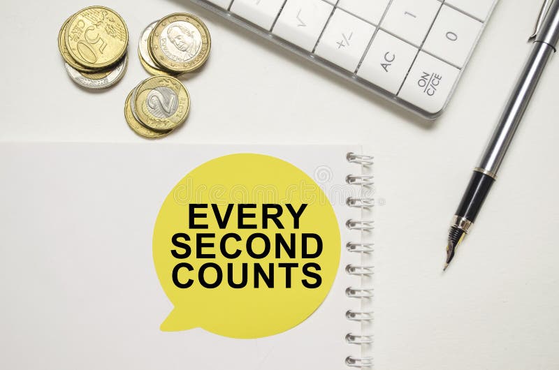EVERY SECOND COUNTS on Yellow Sticker on Pen with Coin Stock Image ...