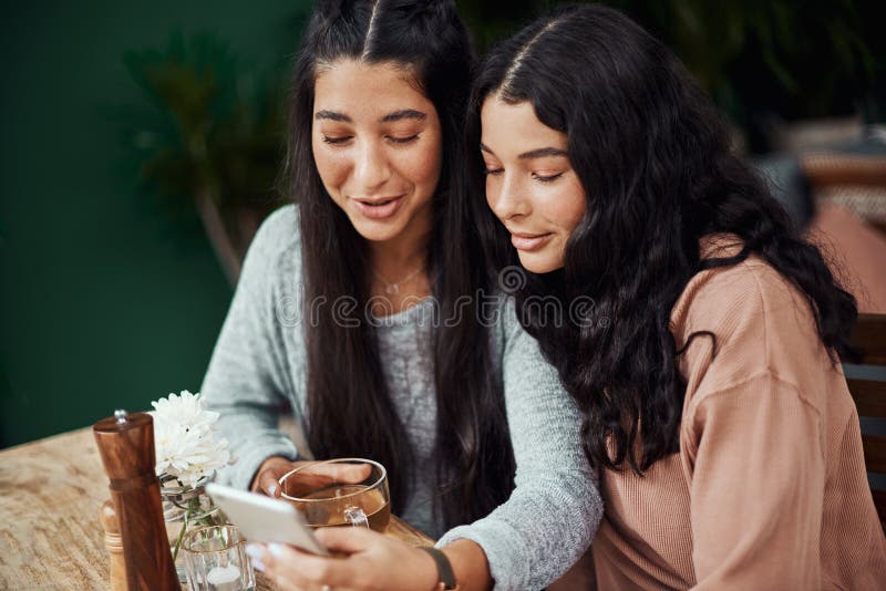 Every Time we Share, we Connect. Young Sisters Using a Smartphone ...