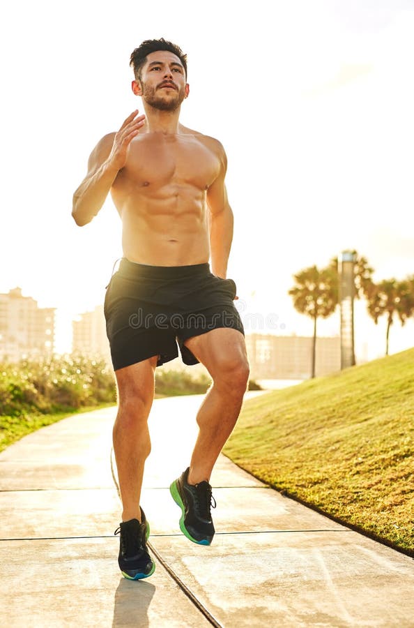 Every Workout Matters. a Handsome Young Man Exercising Outdoors. Stock ...