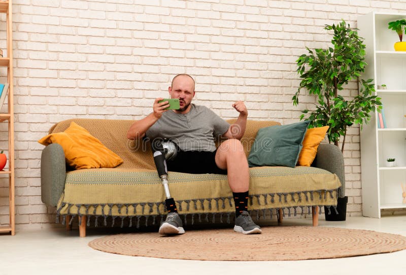 Man Amputee with Bionic Prosthesis Leg Disability Spending Time at Home ...