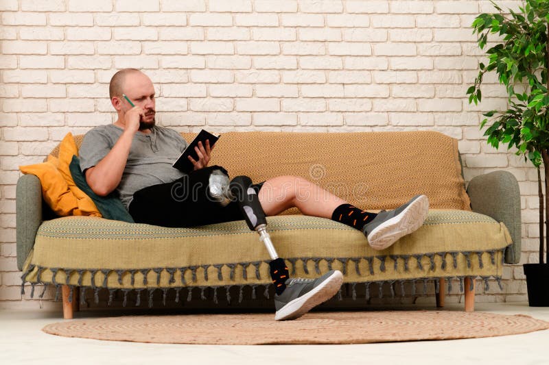 Man Amputee with Bionic Prosthesis Leg Disability Spending Time at Home ...