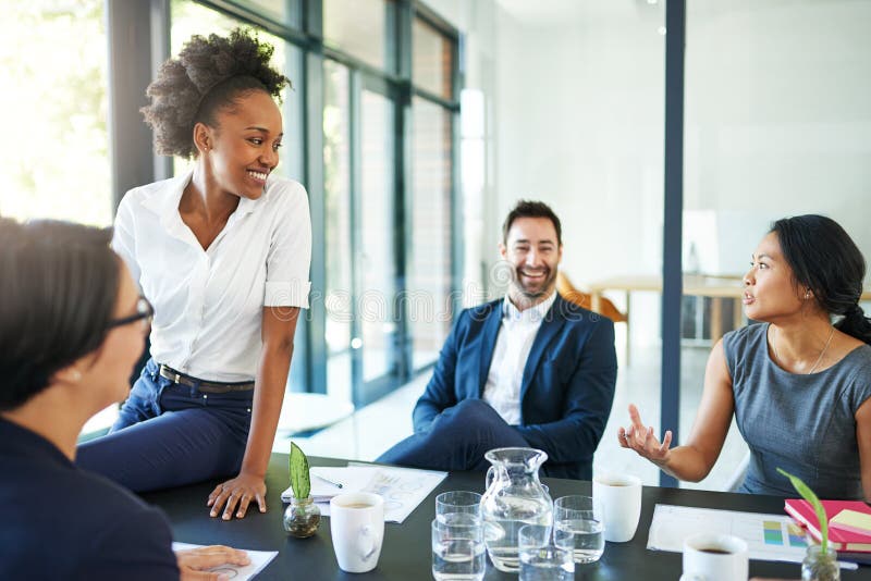 Everyones Positive about Progress. a Group of Colleagues Meeting in the ...