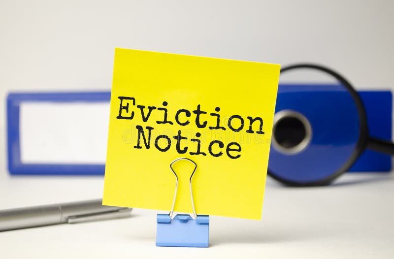 Eviction Notice on the Yellow Sticker and Blue Folder Stock Image ...
