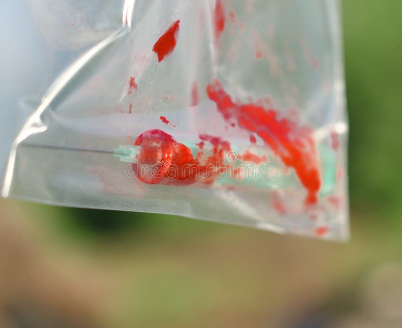 Evidence. Syringe in blood stock photo. Image of scene - 31868542
