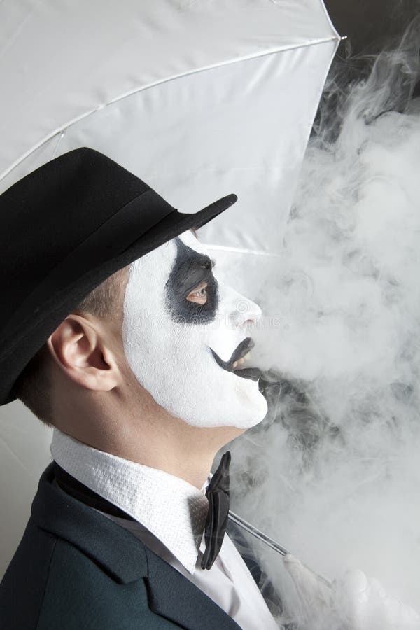 Evil Clown Wearing a Bowler Hat Vaping Stock Photo - Image of evil ...