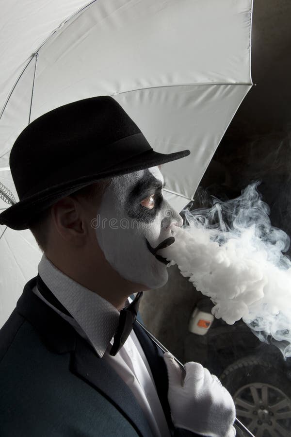 Evil Clown Wearing a Bowler Hat Vaping Stock Photo - Image of people ...