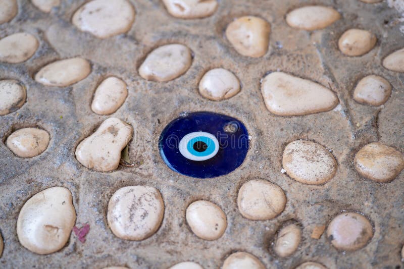 Evil Eye Bead Decor on the Paving Stone Stock Image - Image of design ...