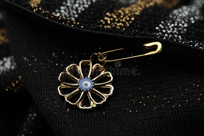 Evil Eye Safety Pin on Clothing, Closeup Stock Image - Image of magic ...