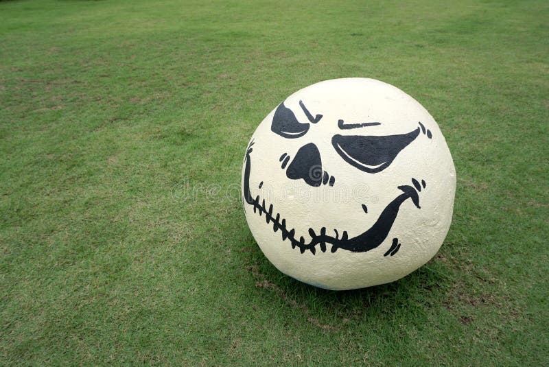 Evil Face Painted on Round Stone Stock Photo - Image of green ...