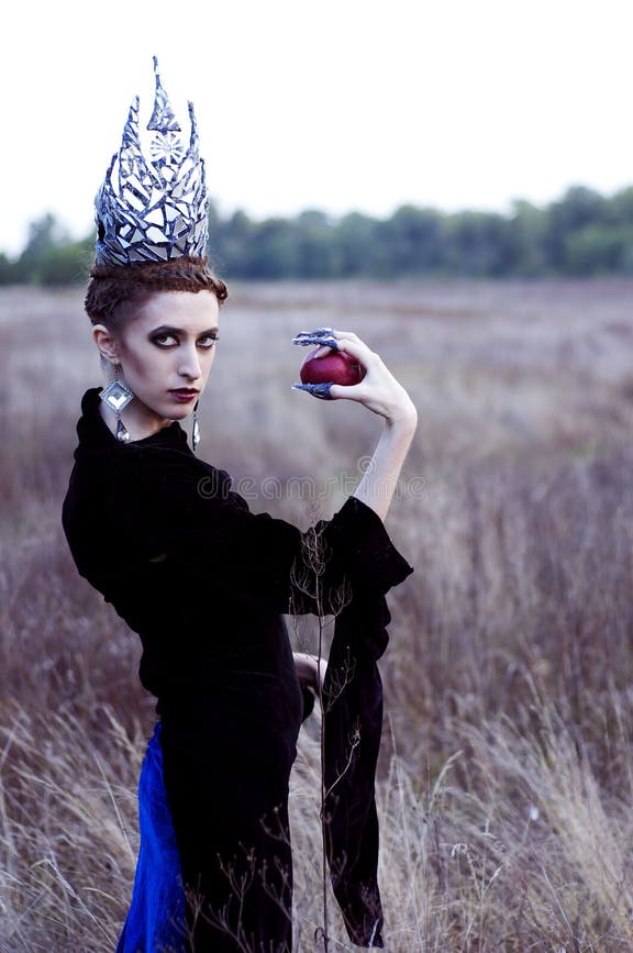 Evil queen with an apple stock image. Image of fiction - 37496593