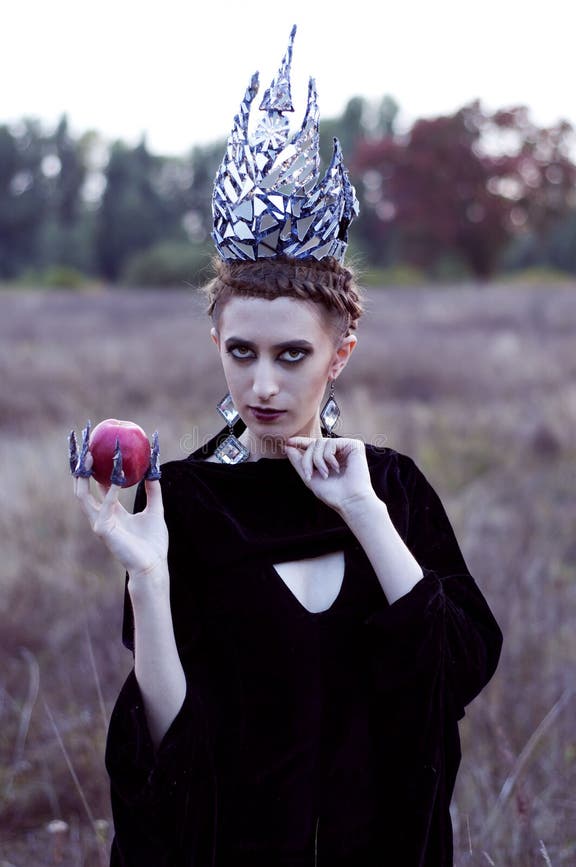 Evil queen with an apple stock image. Image of tale, giel - 37496609
