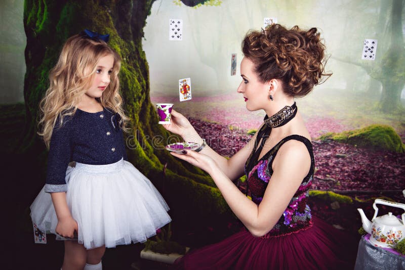 Tea Party of Evil Queen and Alice in Wonderland Stock Image - Image of ...