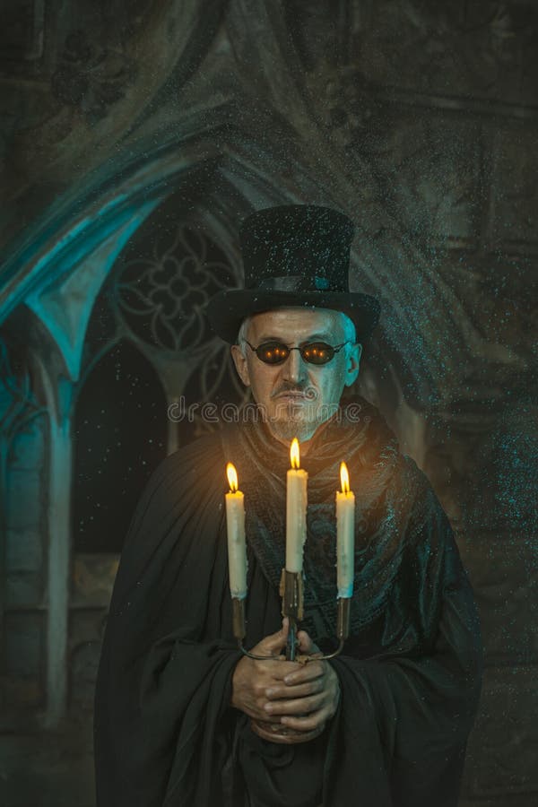 Evil Sorcerer with a Candelabra in Hand. Stock Photo - Image of demon ...