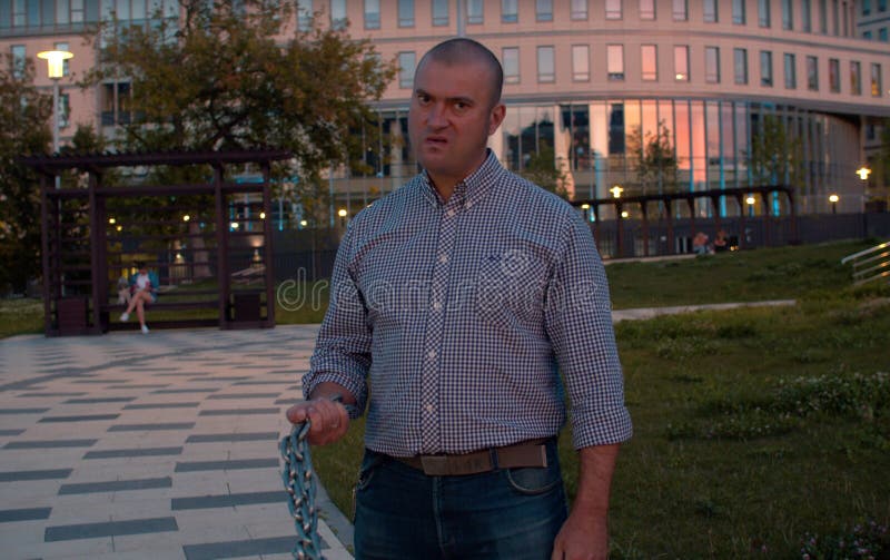 Evil Thug with a Chain in His Hand Stock Photo - Image of furious, face ...