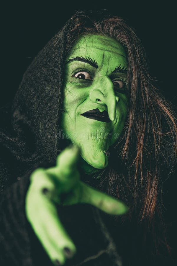 Evil Witch Casting a Curse Under Her Hood Stock Photo - Image of ...