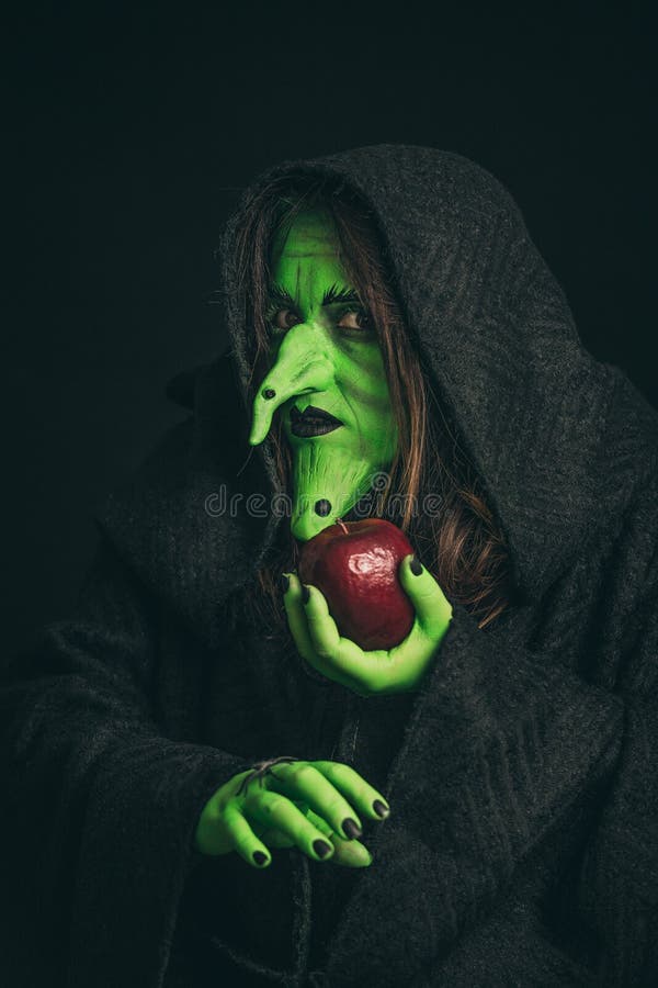 Evil Witch with a Rotten Apple and a Spider on Her Hands Stock Photo ...