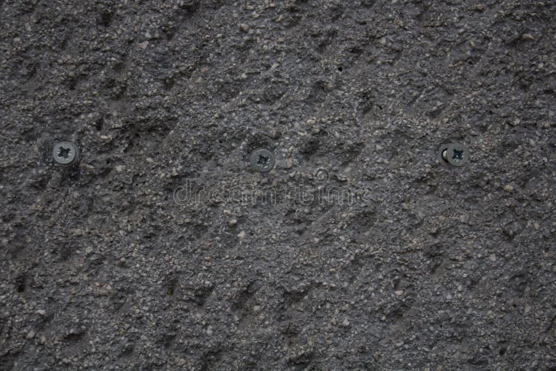 Granite Wall with Three Screws Stock Photo - Image of material, dowels ...