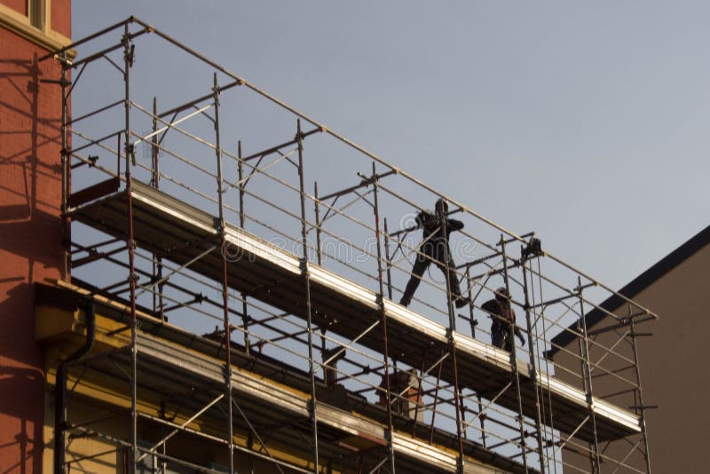 Workers Engaged in Assembling a Scaffolding Stock Image - Image of ...
