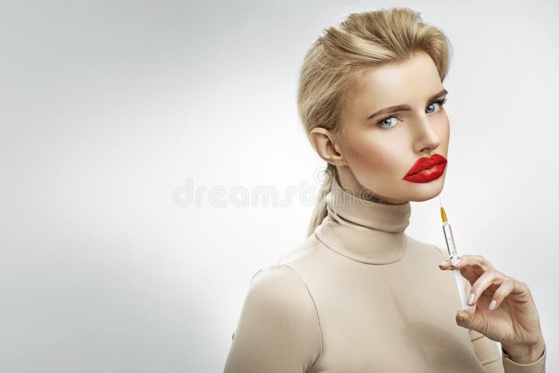 Exaggerated Injection To the Lips of a Beautiful Blonde Stock Image ...