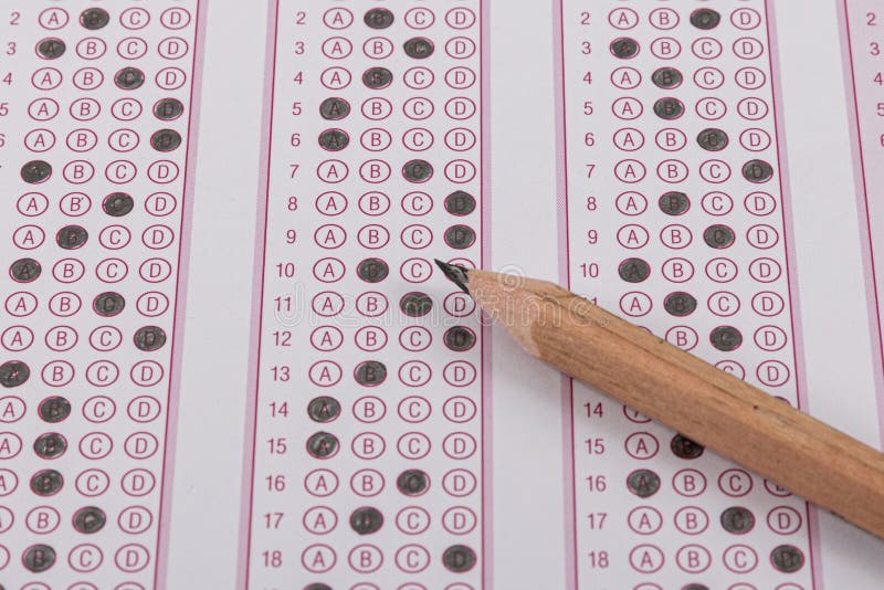 Exam, a Hand Taking an Exam with a Pen on an Optical Reader. Exam, an ...