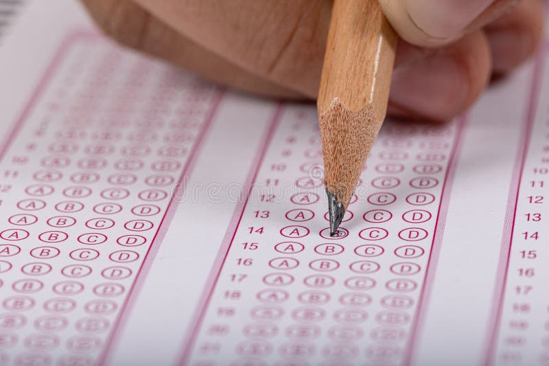 Exam, a Hand Taking an Exam with a Pen on an Optical Reader. Exam, an ...