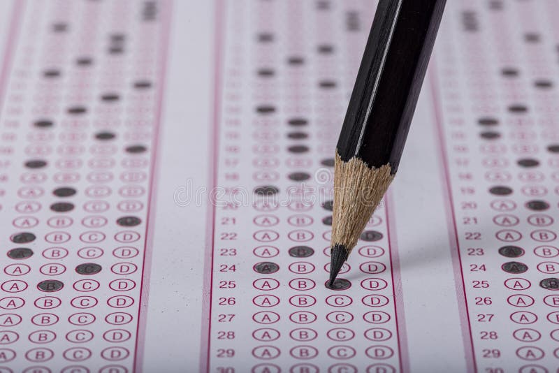 Exam, a Hand Taking an Exam with a Pen on an Optical Reader. Exam, an ...