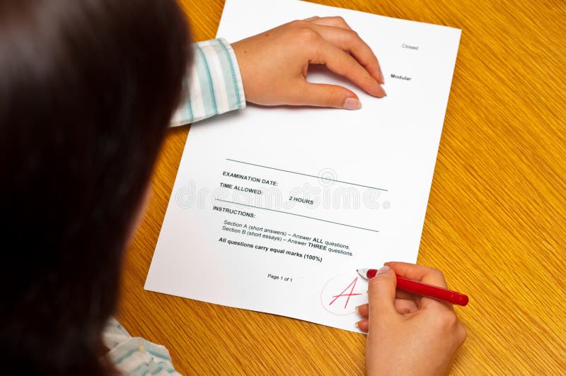 Teacher Grading Papers in School Classroom Stock Photo - Image of ...