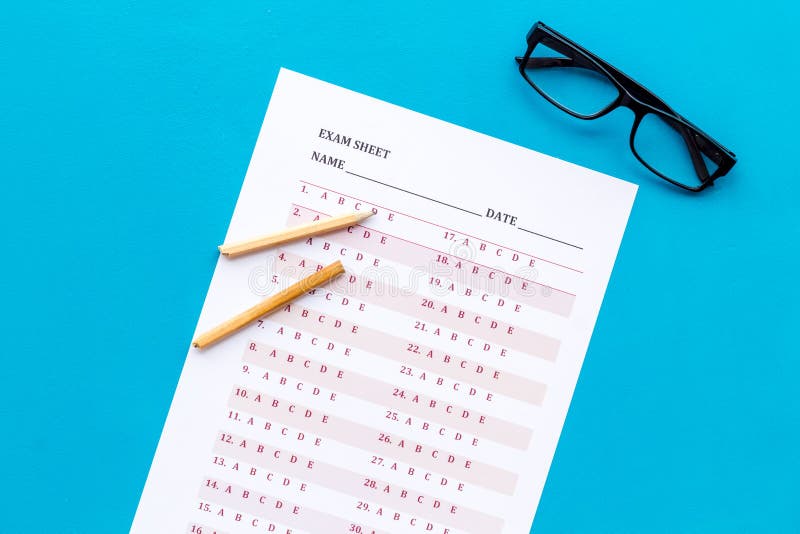 On the Exam. Exam Sheet, Answer Near Glasses and Pencil on Blue ...