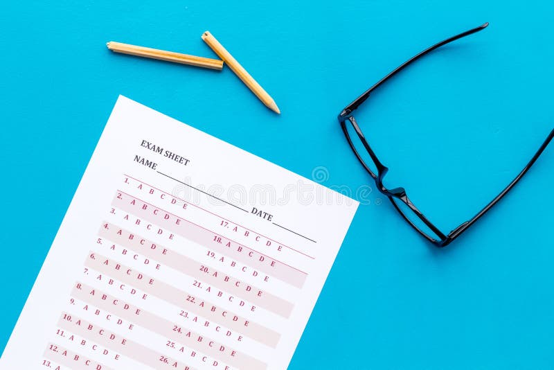 On the Exam. Exam Sheet, Answer Near Glasses and Pencil on Blue ...