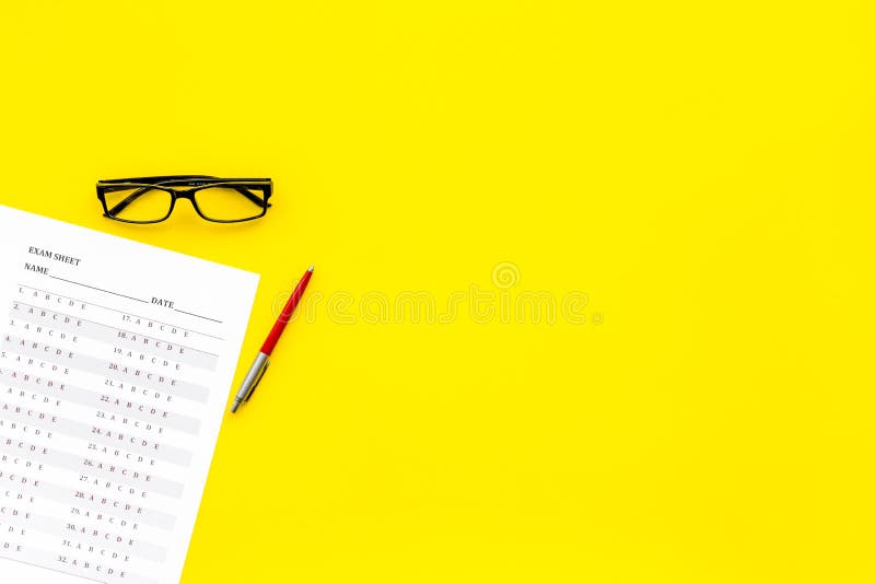 Exam Sheet on Yellow Table Flat Lay Copy Space. Education Concept Stock ...