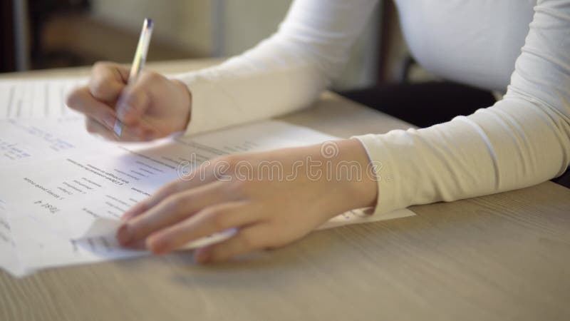 Exam Writing Test Form on Table, Student Taking Exams, Hand with Pen ...