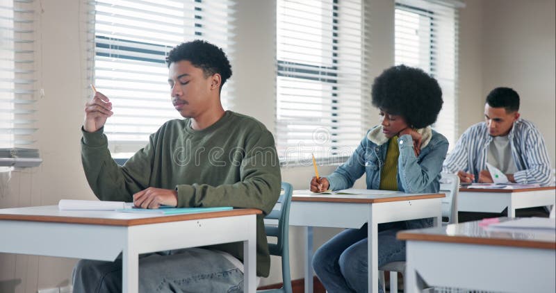 Exam, Thinking and Question with Student in Classroom of School for ...