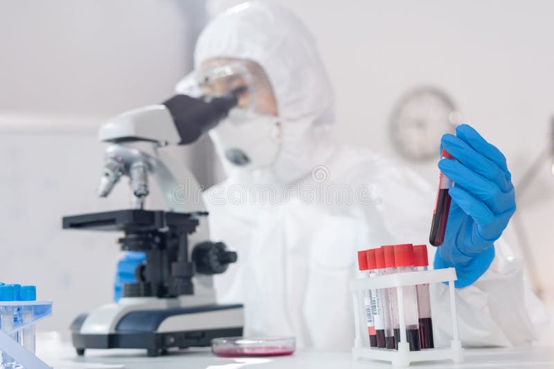 Examining Blood Samples Under Microscope Stock Photo - Image of ...