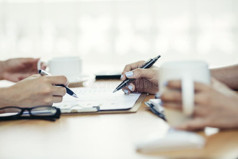 Examining Business Chart on the Table Stock Photo - Image of ...