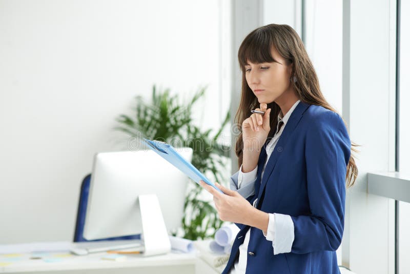 Examining Business Document Stock Photo - Image of young, working ...
