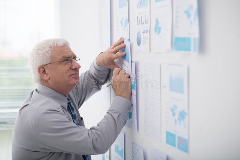 Examining business reports stock image. Image of office - 56755807 Examining business reports stock image. Image of office - 56755807